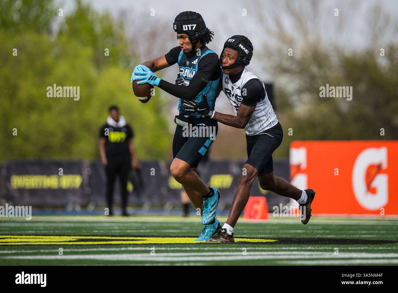 Raw's Brysen Wright catches the football as RWE's Chauncey Kennon gets ...