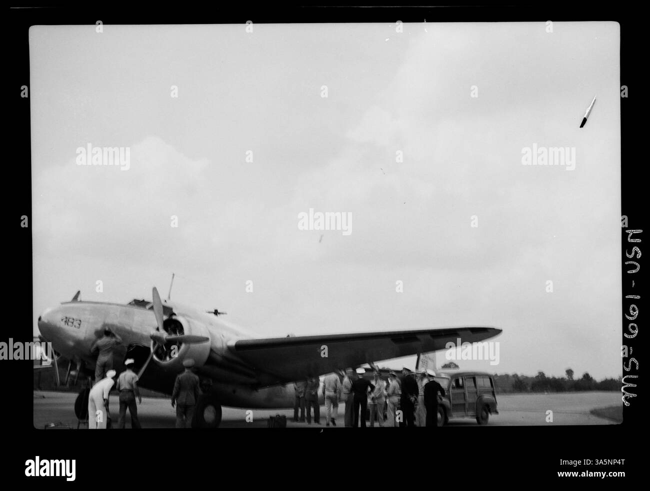 This photograph features Navy personnel at an unidentified airfield in ...