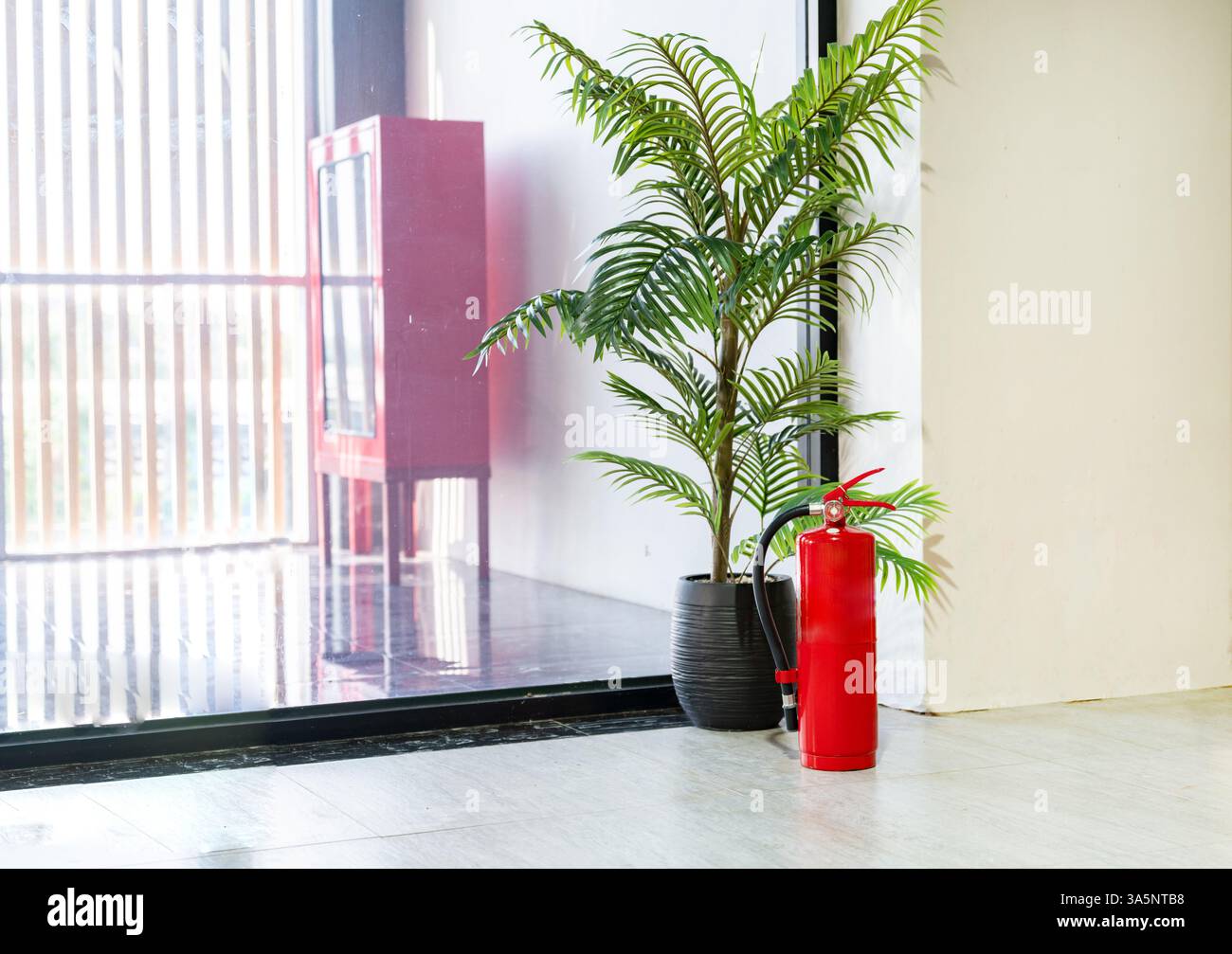 Fire extinguishers and fire hose cabinets are installed at the office ...