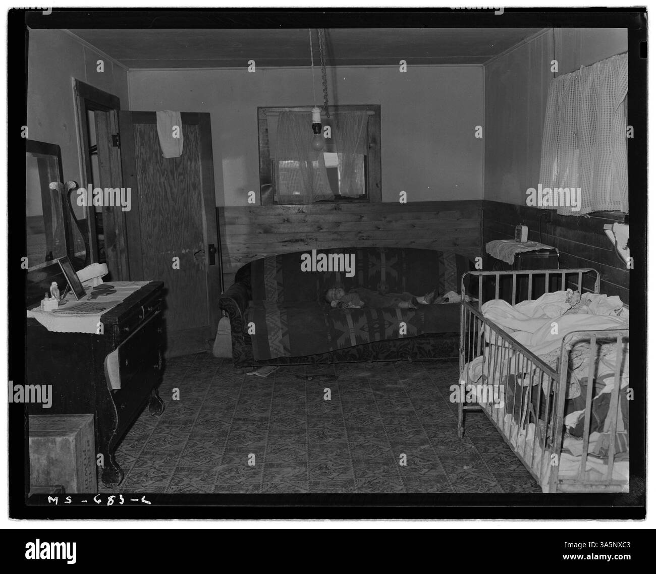 The living room of Ben Baker’s home, a miner living in company housing ...
