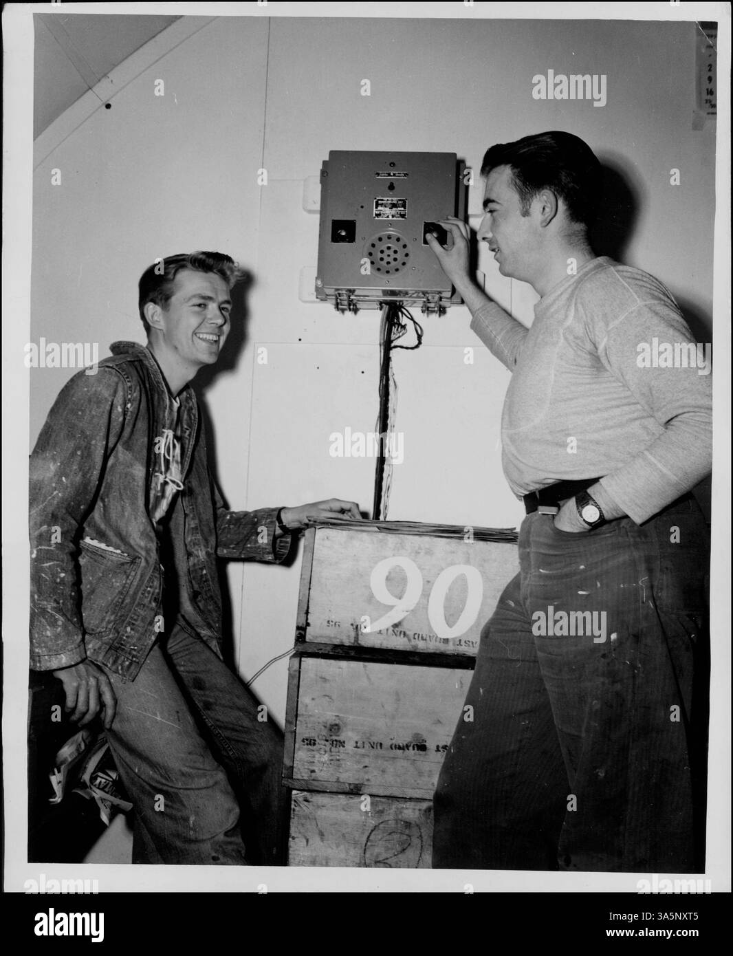 Coast Guardsman Grant E. Anderson and radar man William J. Dahl are ...