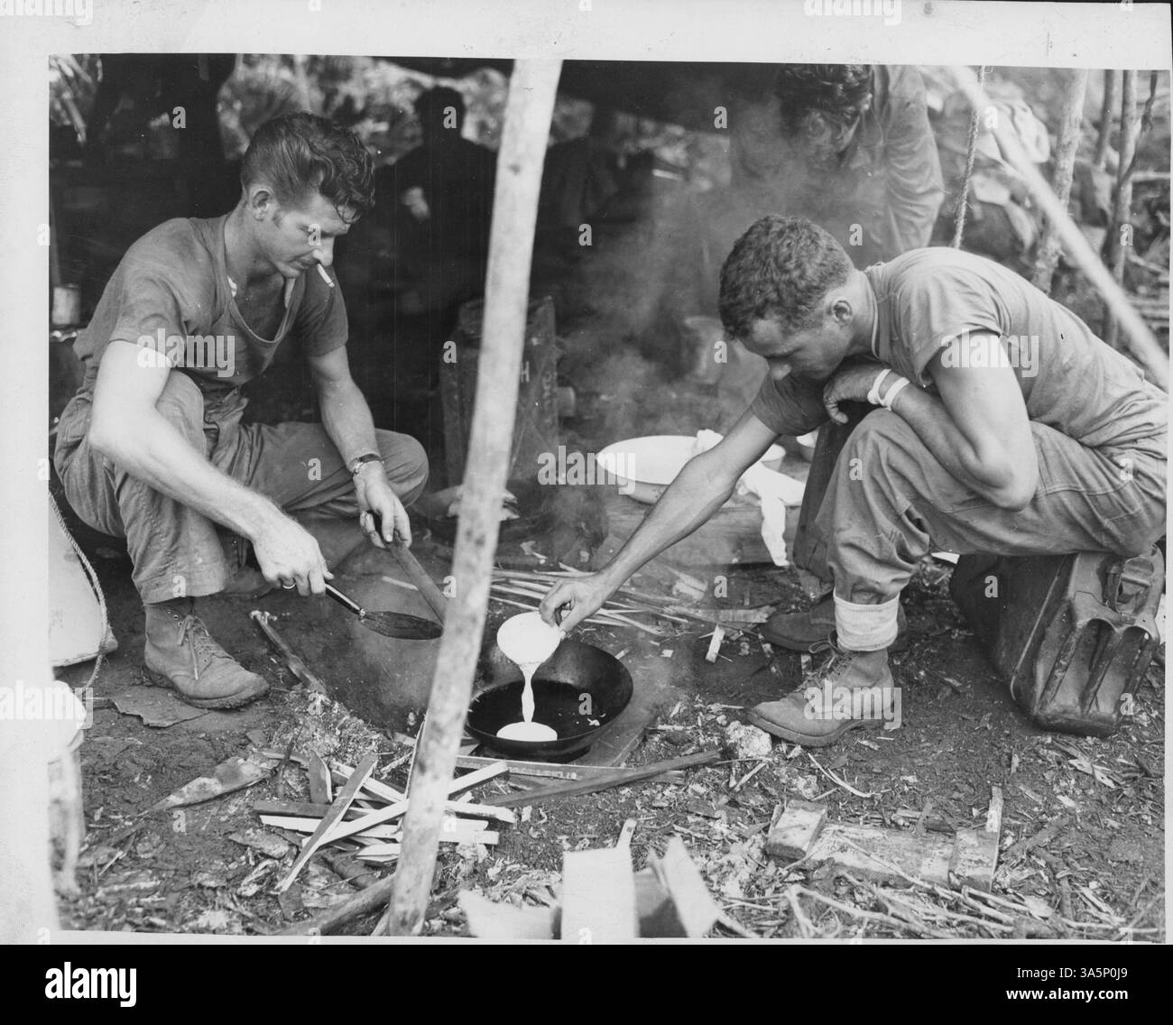 Sailor Perry and Sergeant Solovic prepare flapjacks for breakfast in ...