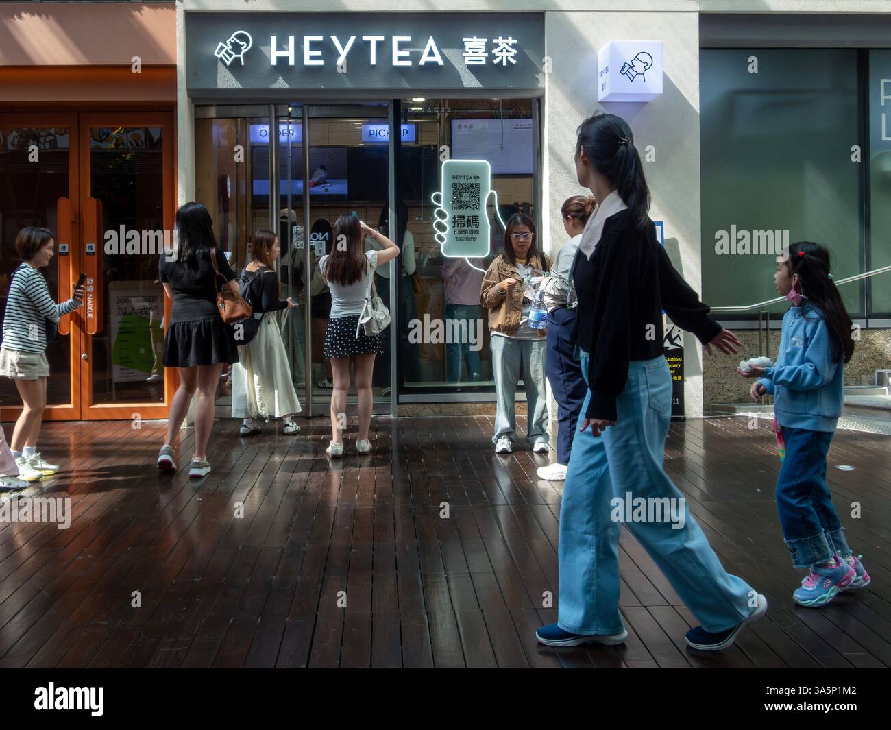 Hong Kong, China. 23rd Mar, 2025. People seen walking past the HEYTEA store in K11 Art Mall ...