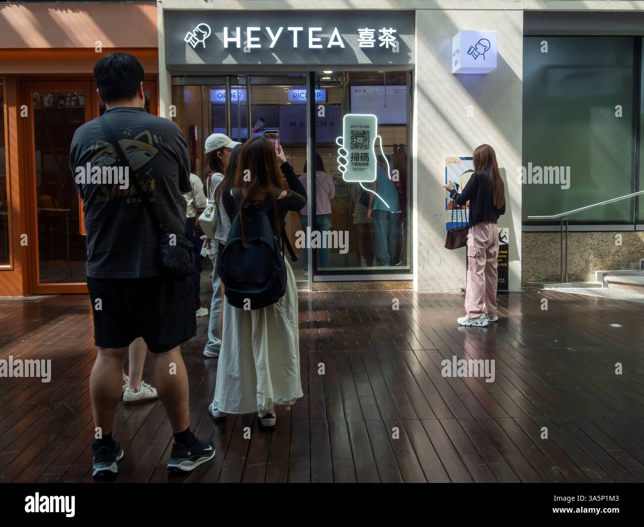 Customers seen lining up to buy drinks at the HEYTEA store in K11 Art Mall. HEYTEA, a popular ...