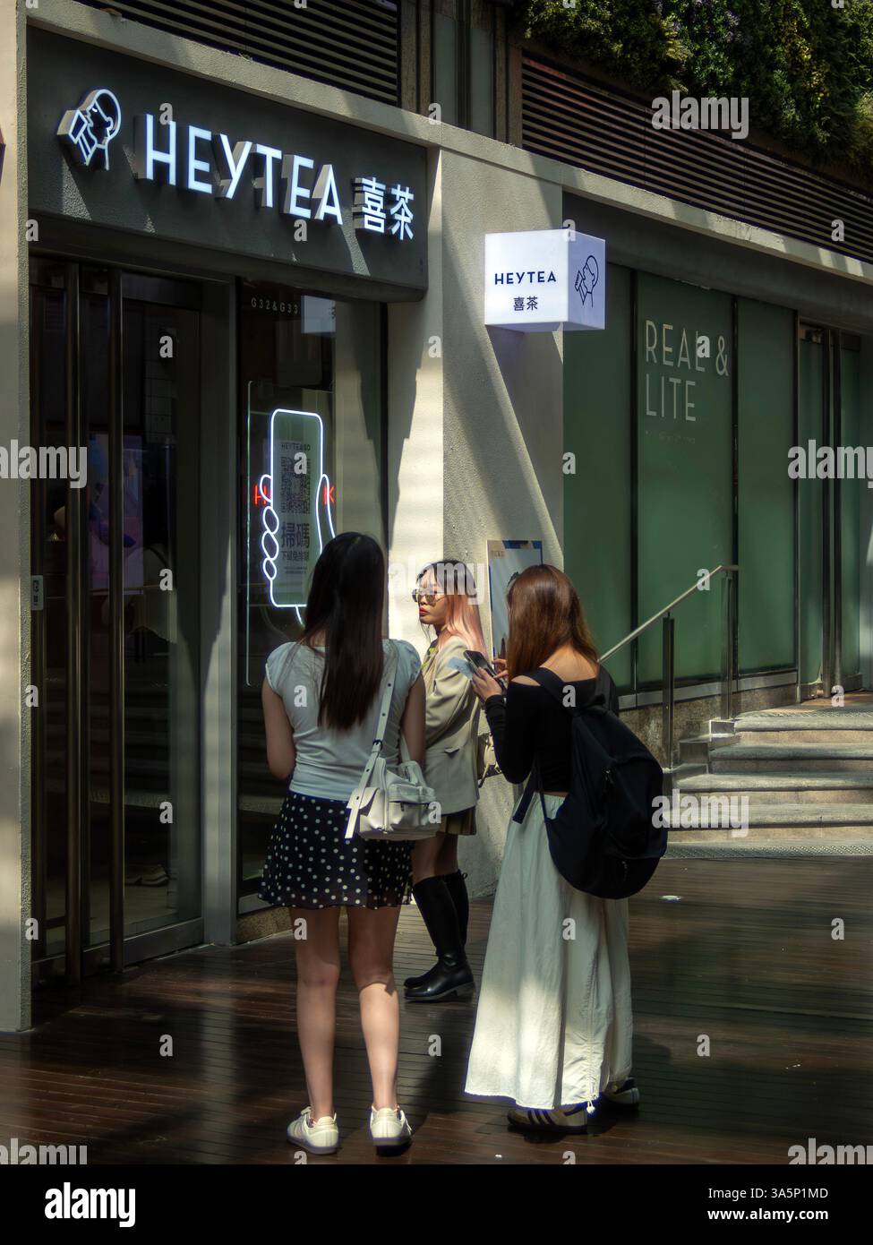 Hong Kong, China. 23rd Mar, 2025. Customers seen waiting to buy drinks at the HEYTEA store in ...