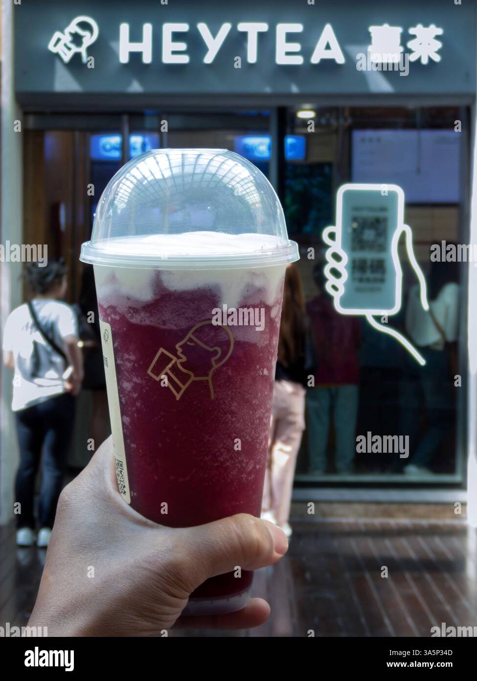 Hong Kong, China. 23rd Mar, 2025. A customer holds a drink in front of ...