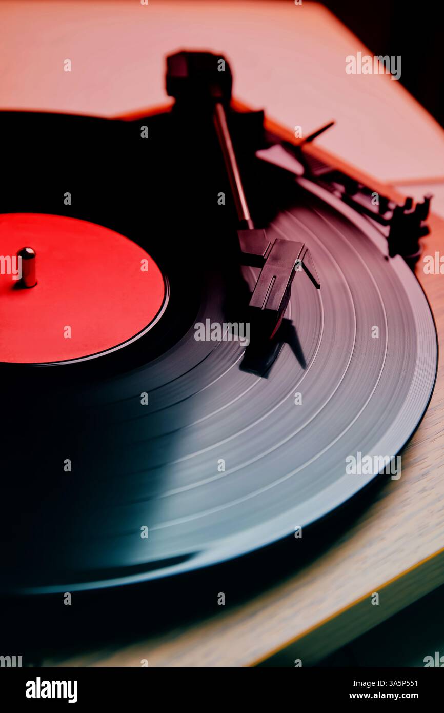 Turntable with vinyl record, closeup. Color toned Stock Photo - Alamy