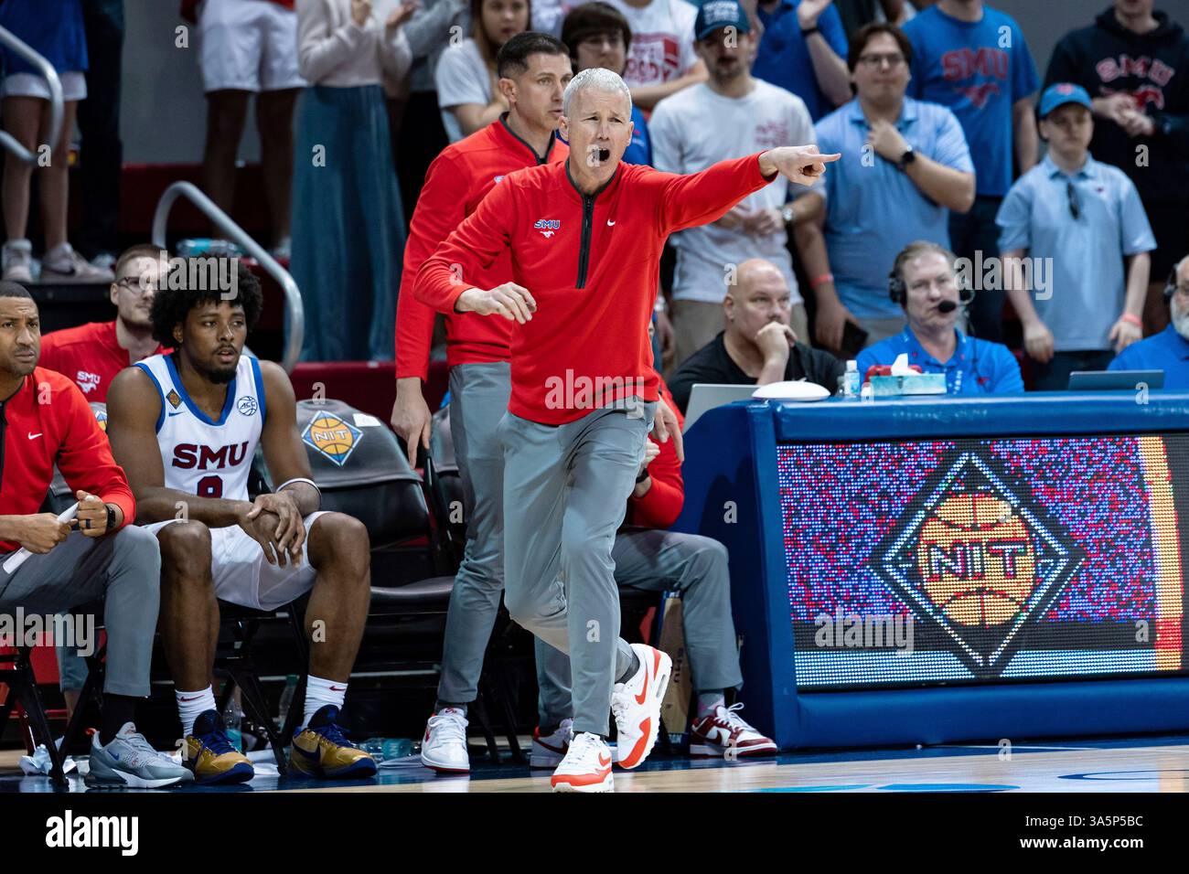 DALLAS, TX - MARCH 23: SMU Mustangs head coach Andy Enfield calls out a ...