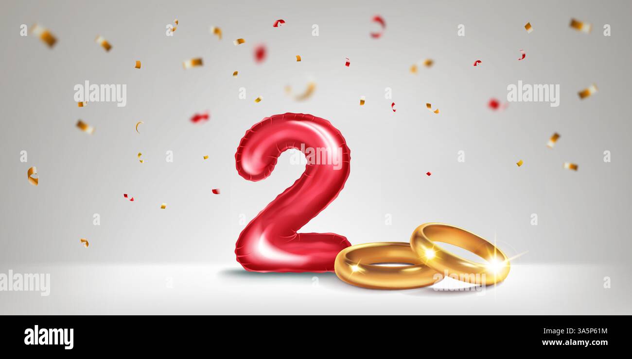 A red number 2 in the form of an inflatable balloon with two gold ...