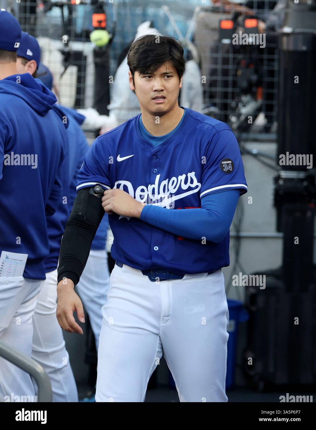 Los Angeles Dodgers' Shohei Ohtani walks in the dugout after grounding ...