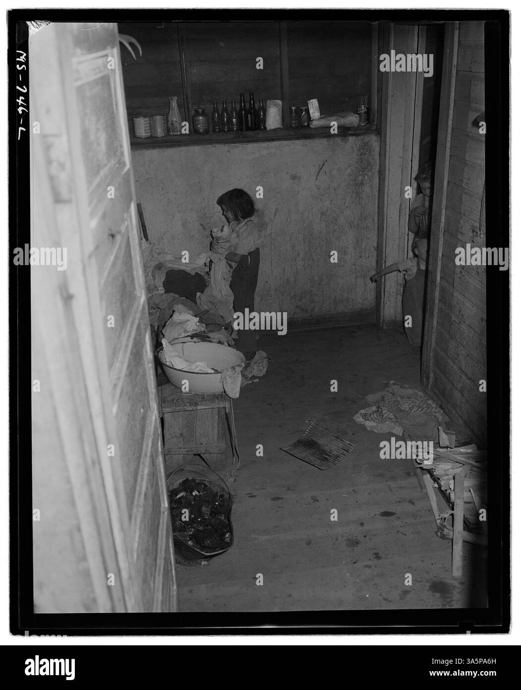 A child of Charles B. Lewis on the back porch of his home in the ...