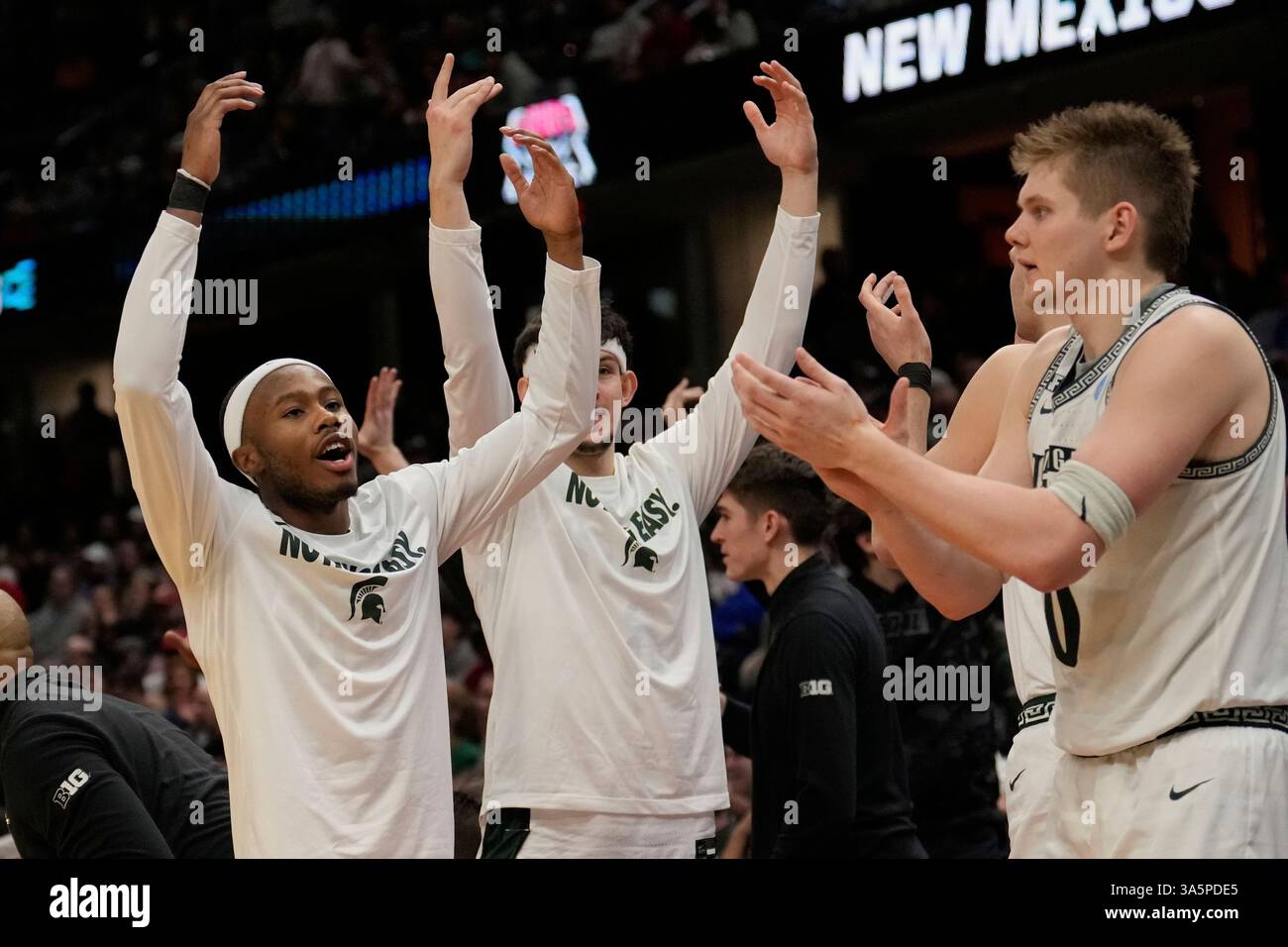 Michigan State players celebrate in the second half of a game against ...