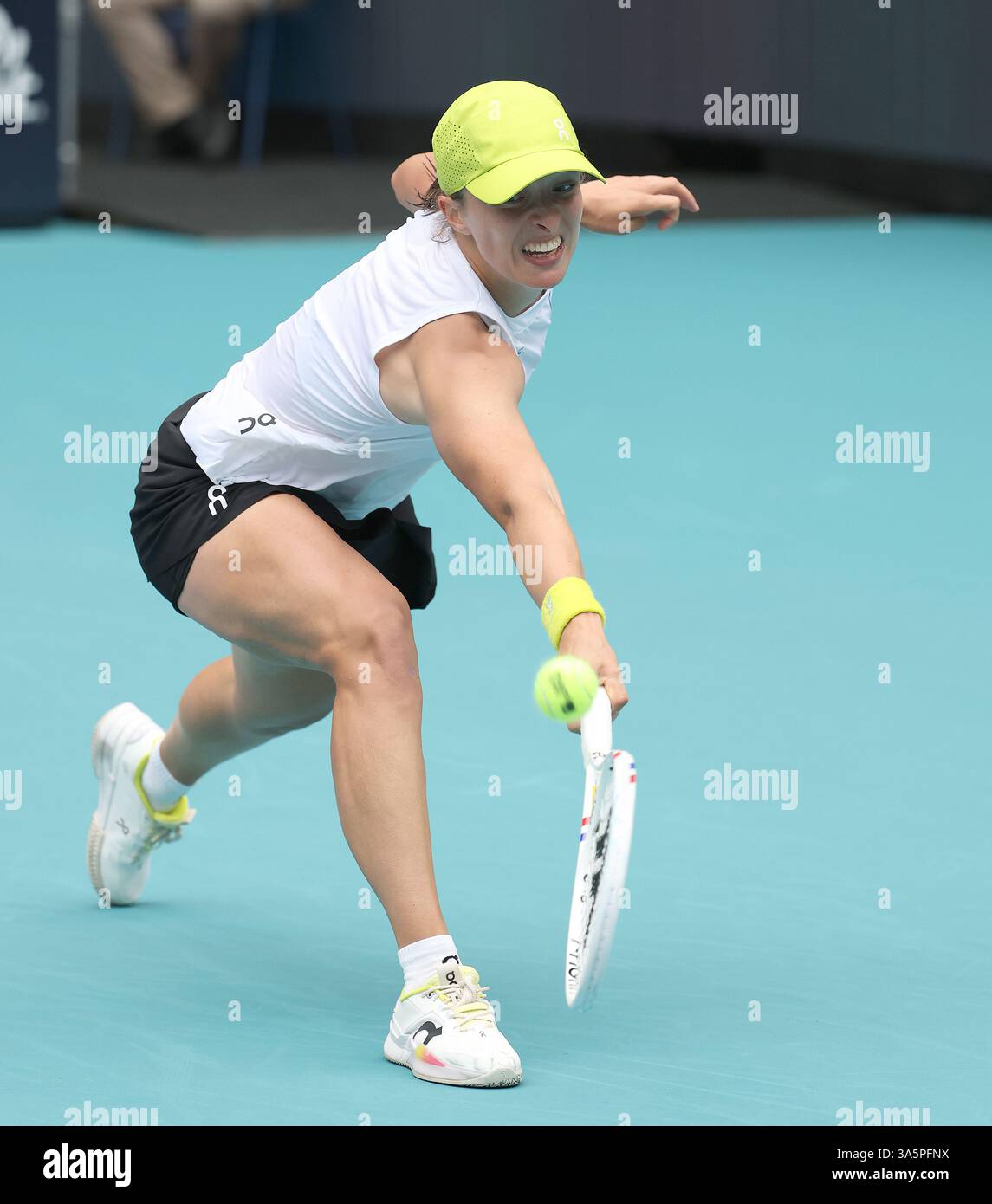 MIAMI GARDENS, FLORIDA - MARCH 23: Iga Swiatek of Poland defeats Elise Mertens of Belgium in the ...