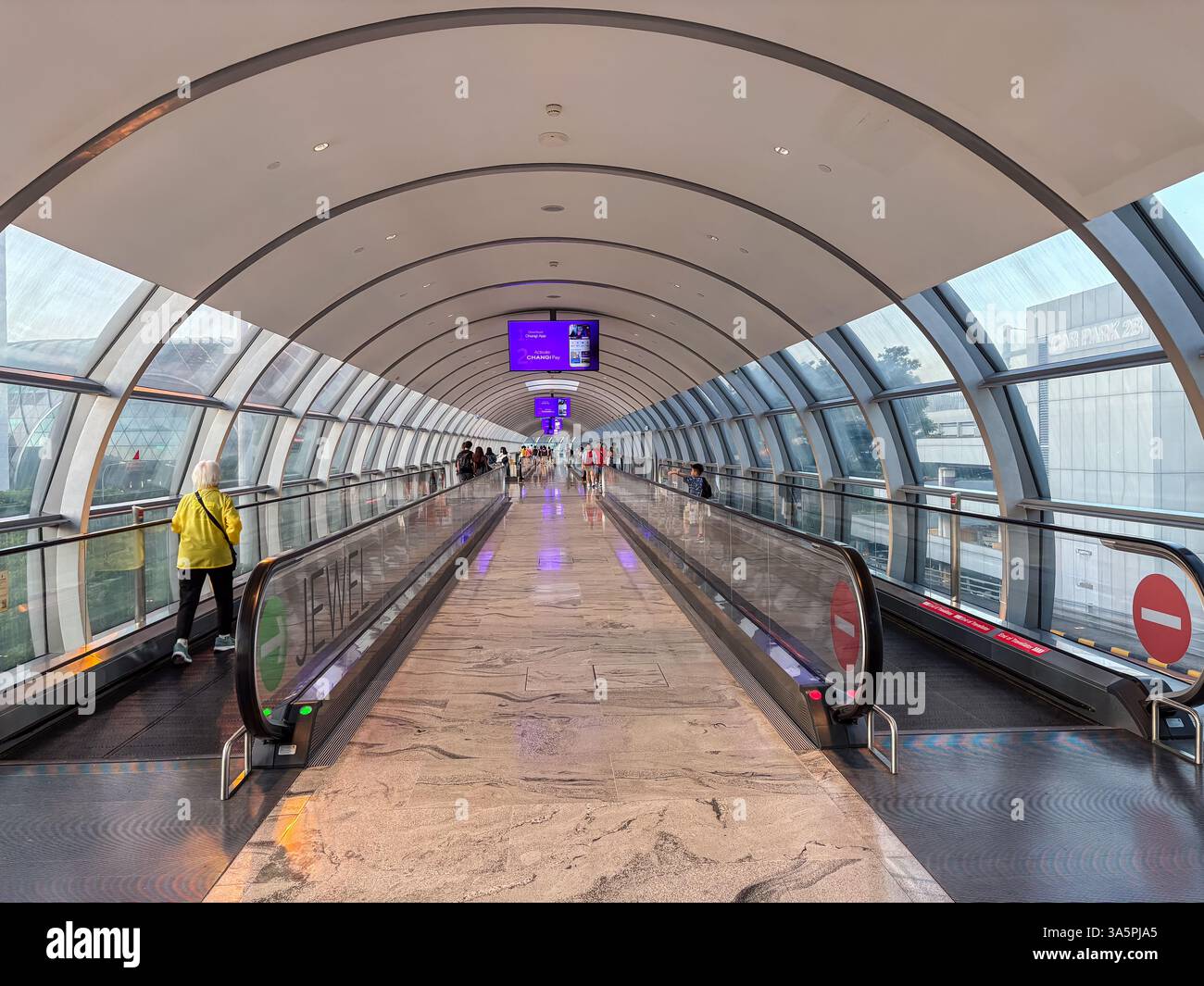 Changi international airport walkway is a long passage with moving ...
