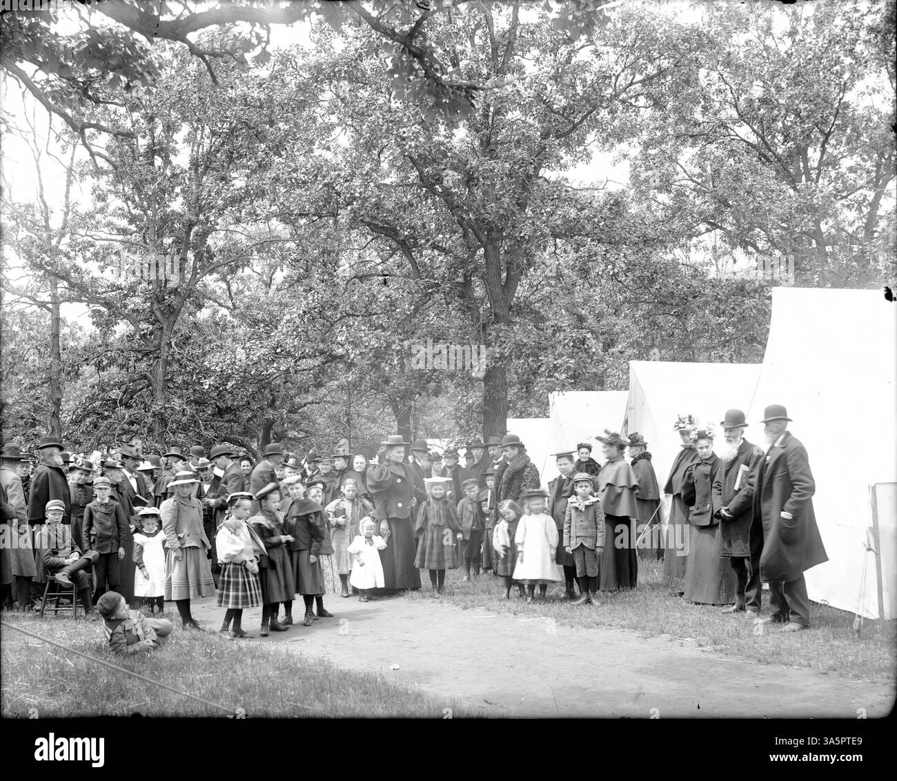 A crowd gathers at the Seventh Day Adventist’s camp in the Midway area ...