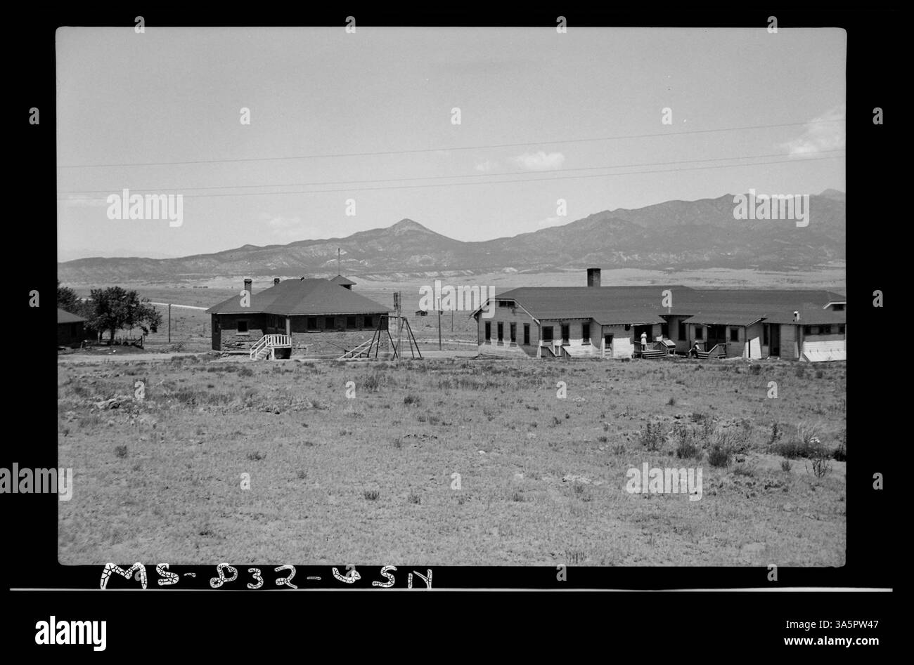 A photograph depicting a mining community, capturing daily life and the ...