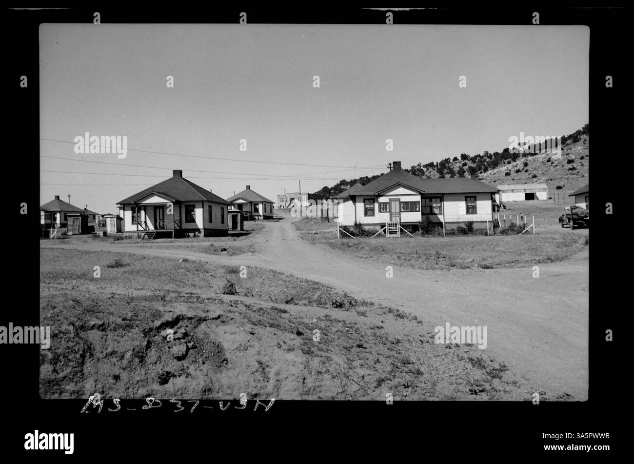 A photograph depicting a mining community, showcasing the living ...