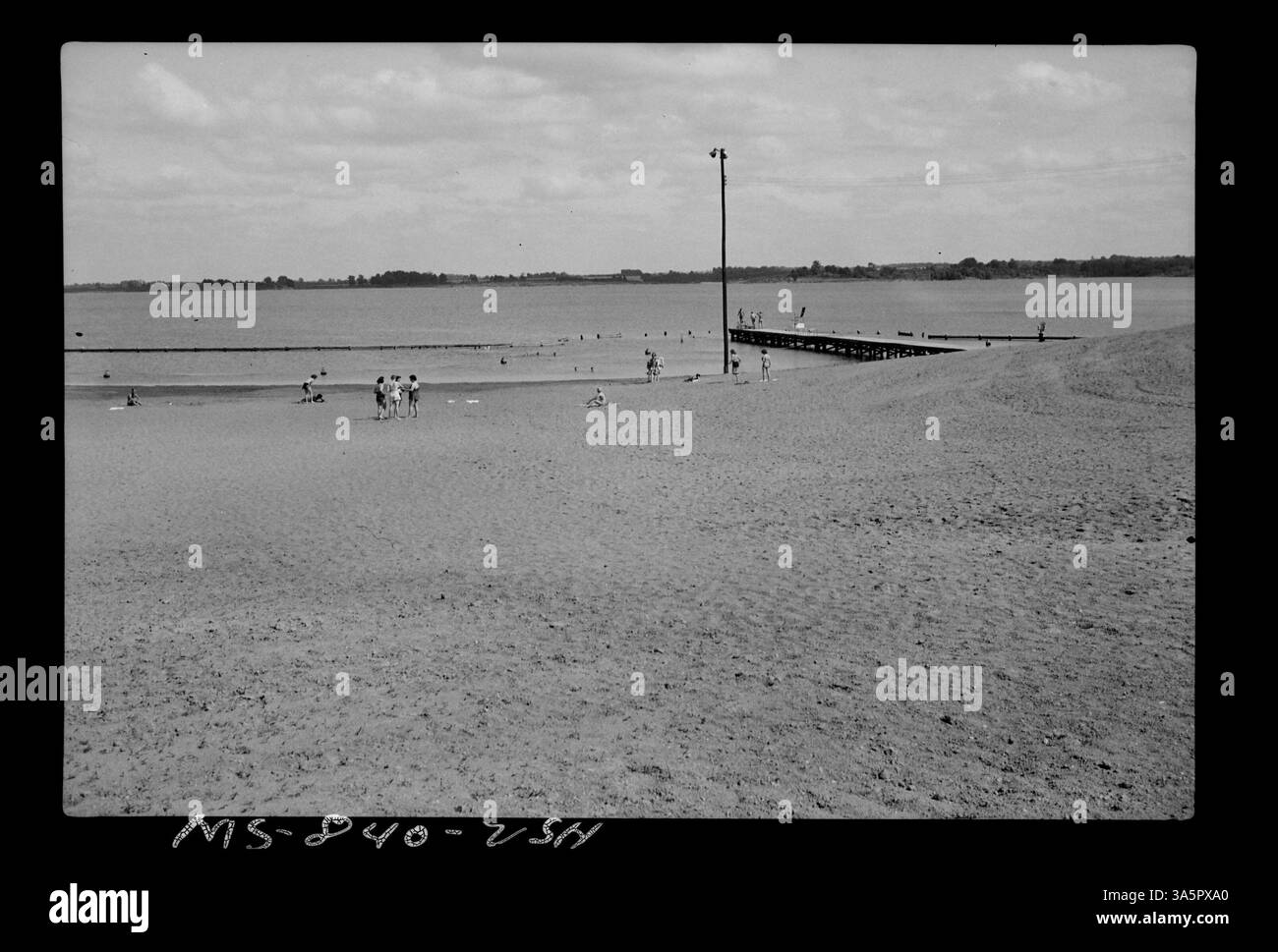 This photograph shows a mining community, capturing the daily life and ...