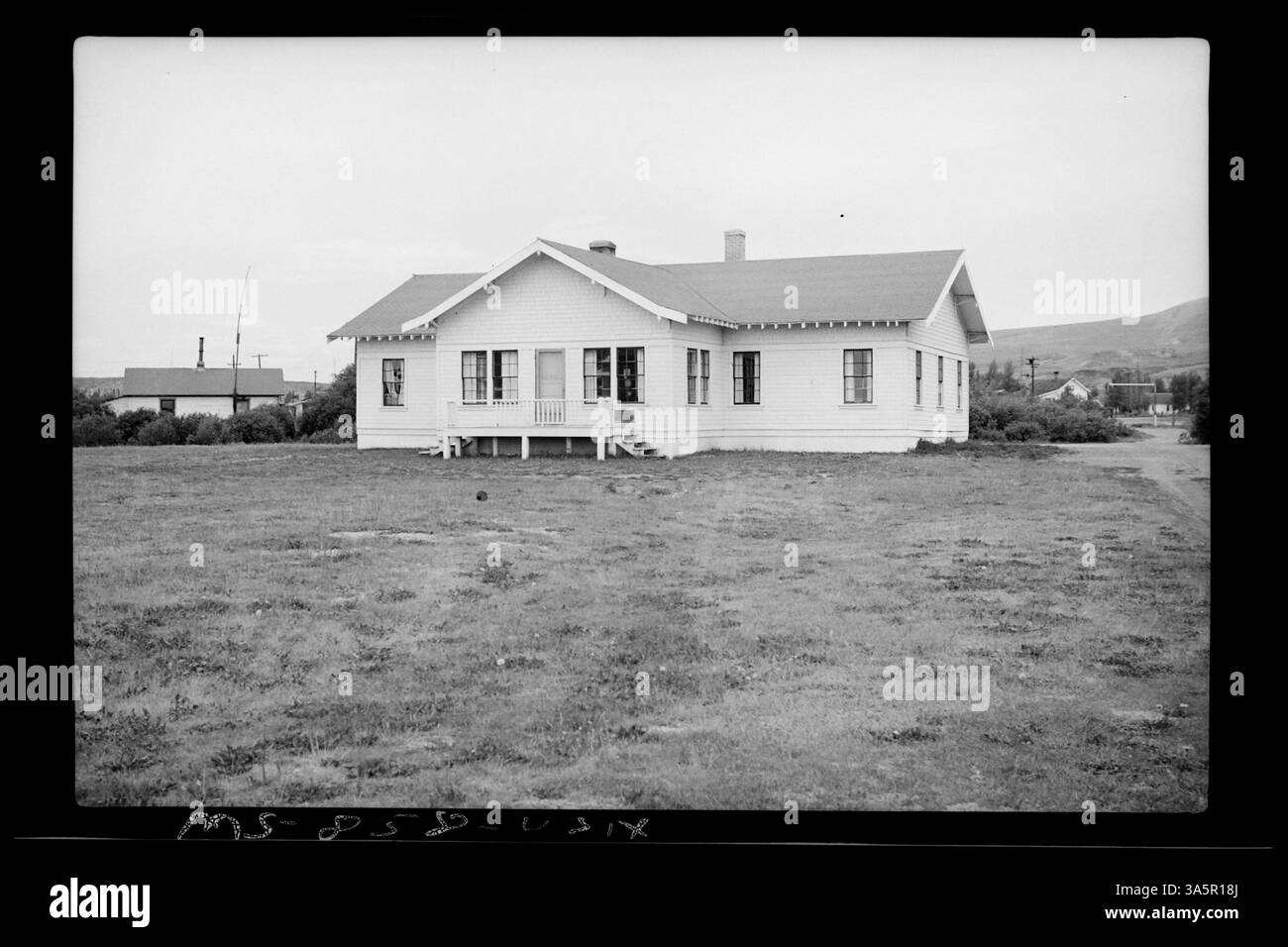 This photograph shows a general view of a mining community in the 1940s ...