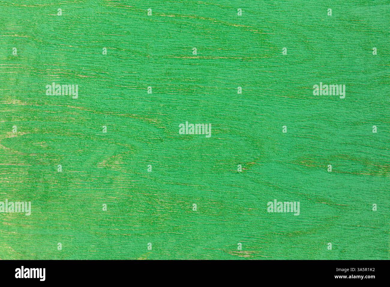 shabby painted green plywood texture with cracks and peeling of paint ...