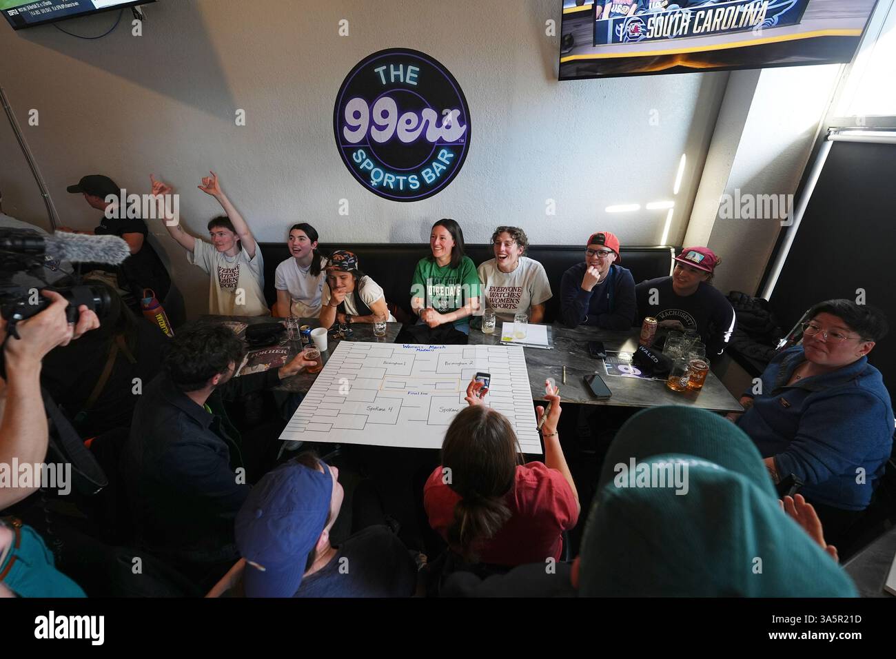 Patrons cheer during the selection show for the NCAA women's college ...