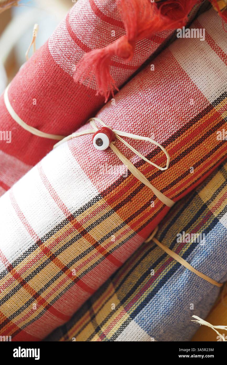 Colorful woven fabrics displayed in a market stall Stock Photo - Alamy