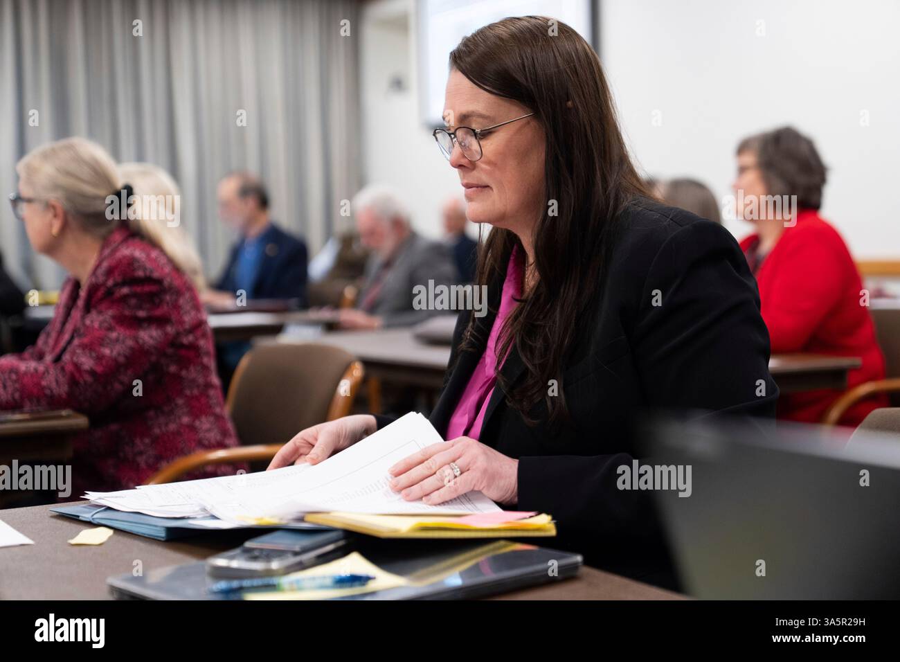Oregon state Sen. Sara Gelser looks through papers during a special ...