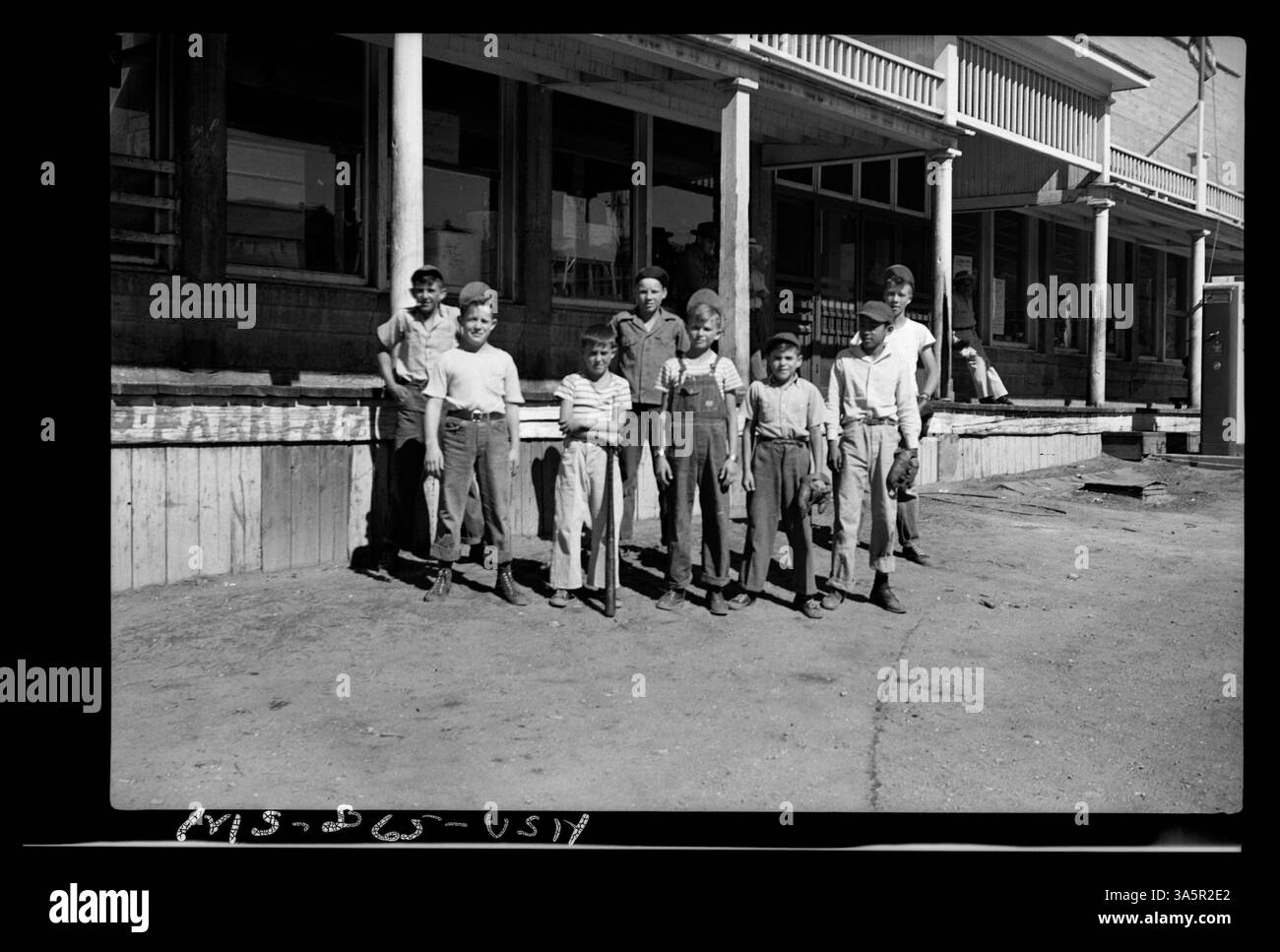 A photograph of a boys' baseball team in a mining community, capturing ...