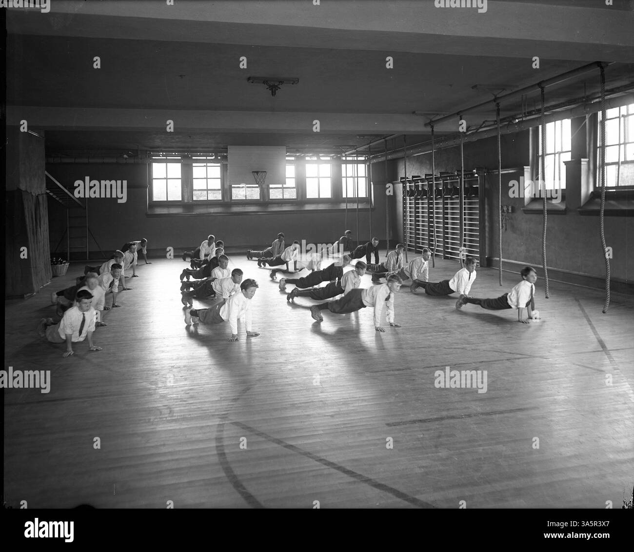 This image captures boys in a physical education class inside Irving ...