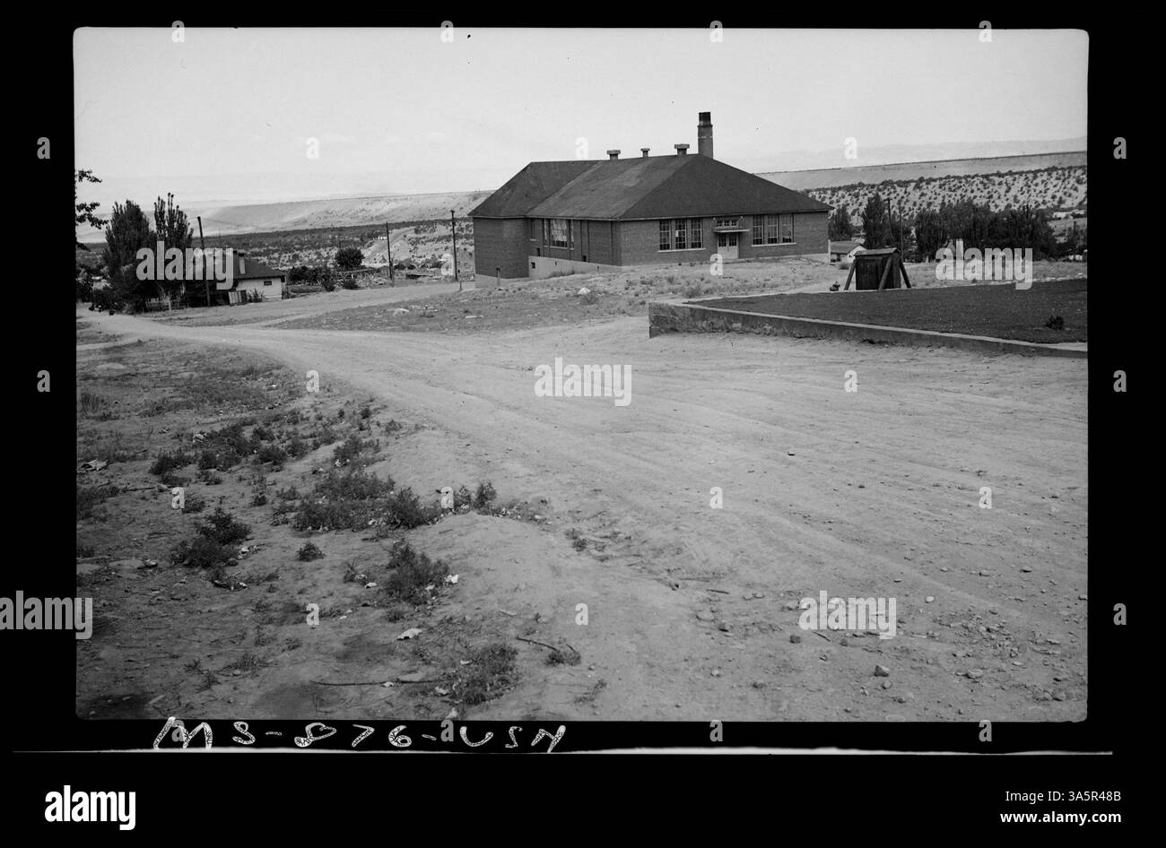 A photograph depicting a mining community, highlighting the residential ...