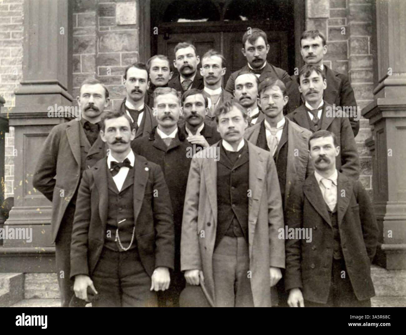 A group portrait of the Mustache Club, consisting of fifteen men with ...