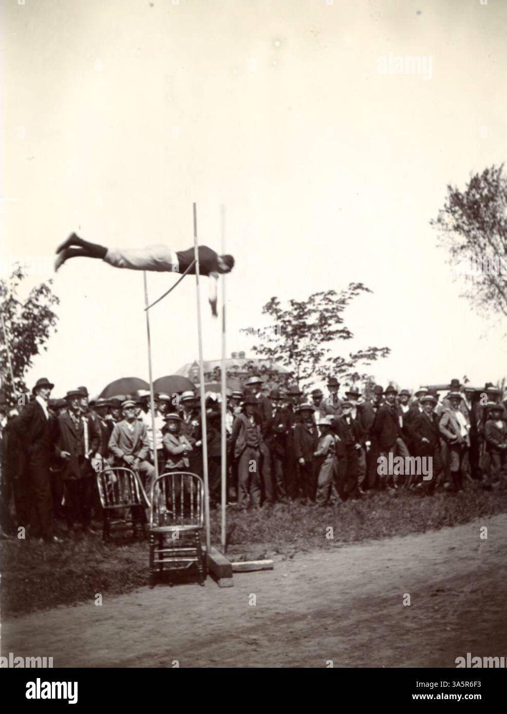 A pole vaulter clears the bar during the Field Day competition at ...