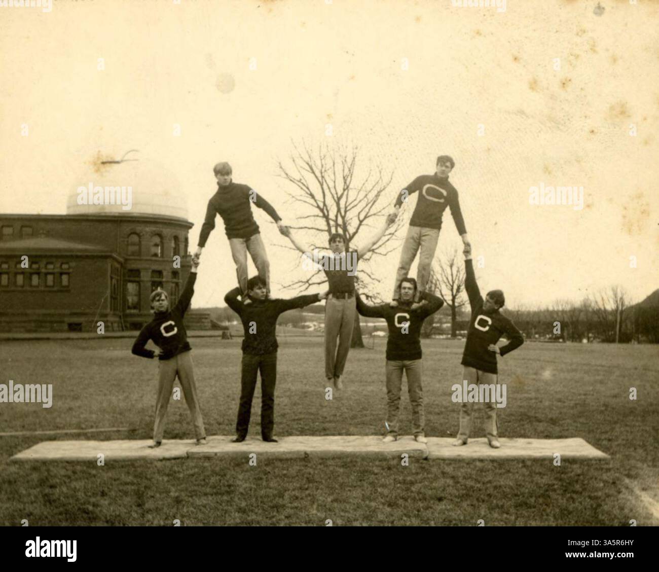 Carleton College students perform a gymnastics exhibition in an 'M ...