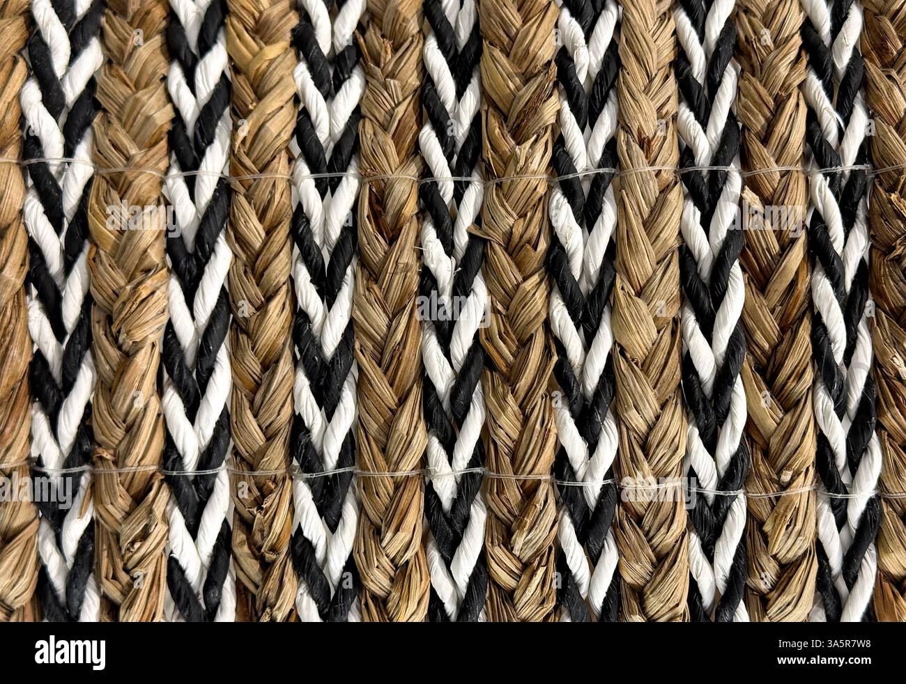 Close up of rattan basket with woven chevron pattern. Braided chevron V ...
