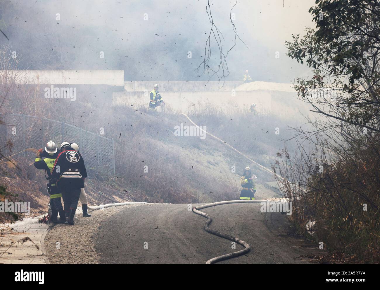 Firefighters struggle to prevent fire spread in Imabari City, Ehime ...