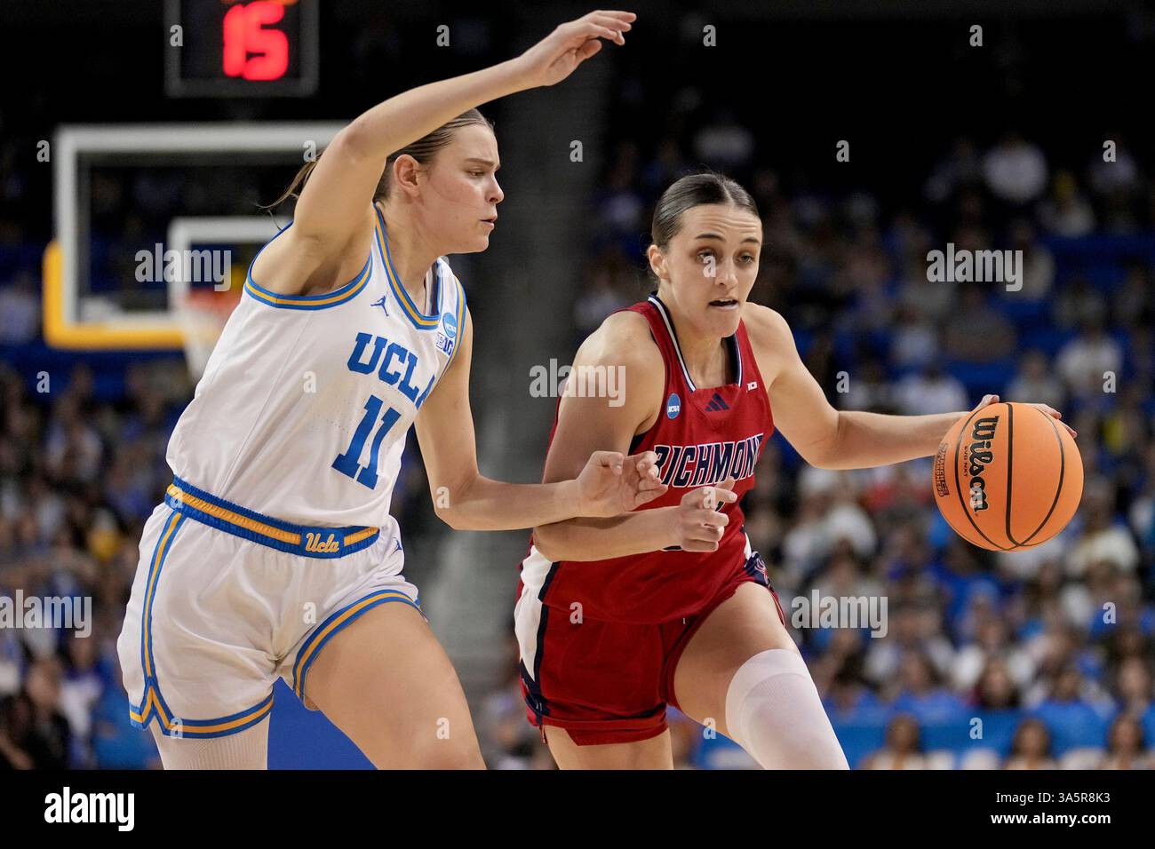 Richmond guard Rachel Ullstrom (22) dribbles against UCLA guard ...