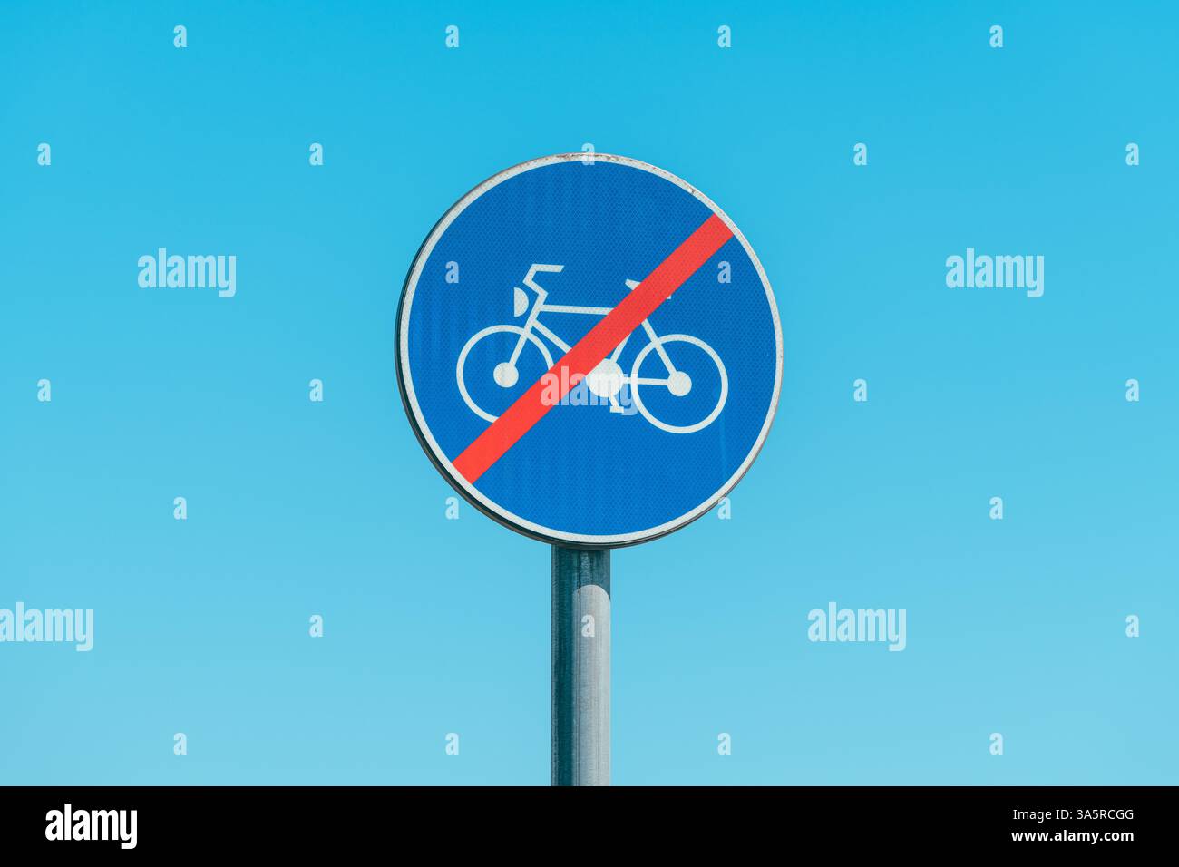 End of the bike lane traffic sign against blue sky, selective focus Stock Photo - Alamy