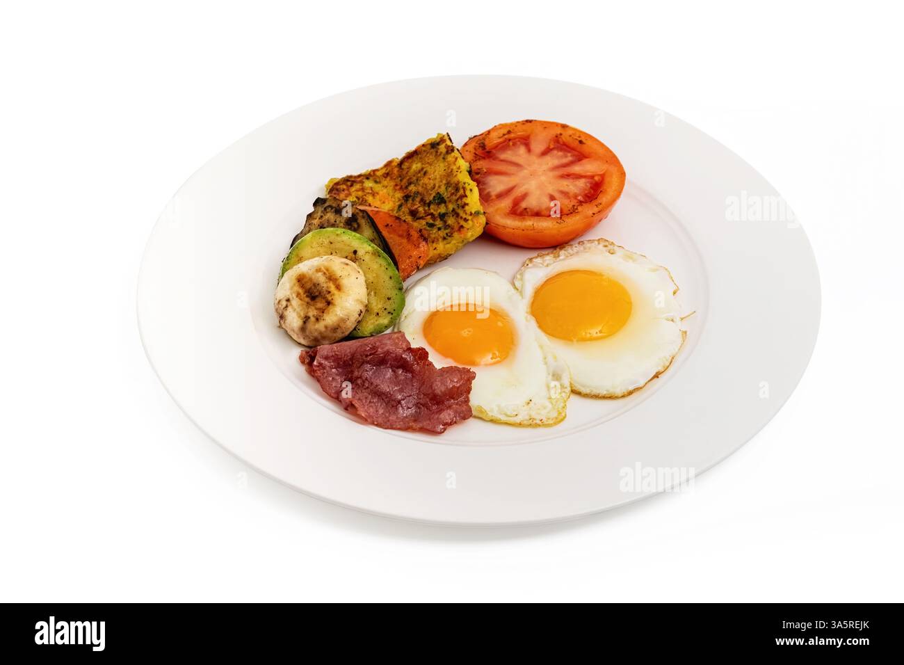 Rustic breakfast plate with fried eggs, grilled vegetables, and turkey ...