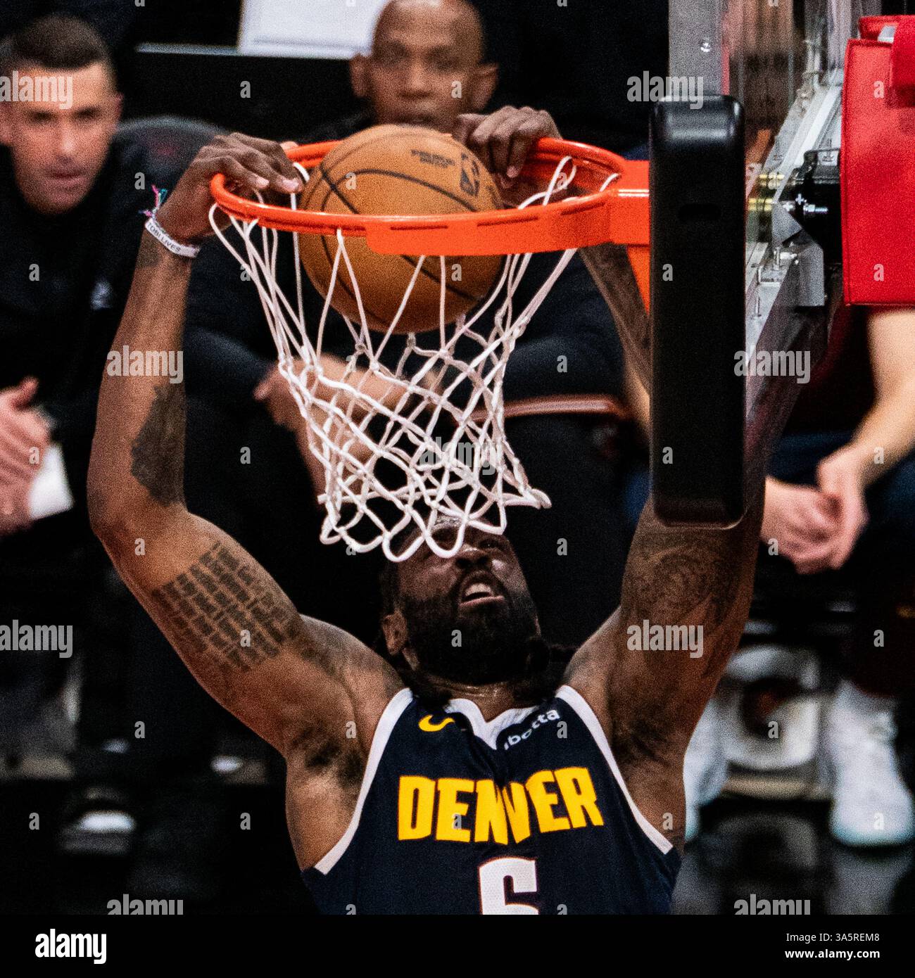 Houston, USA. 23rd Mar, 2025. DeAndre Jordan of Denver Nuggets dunks ...