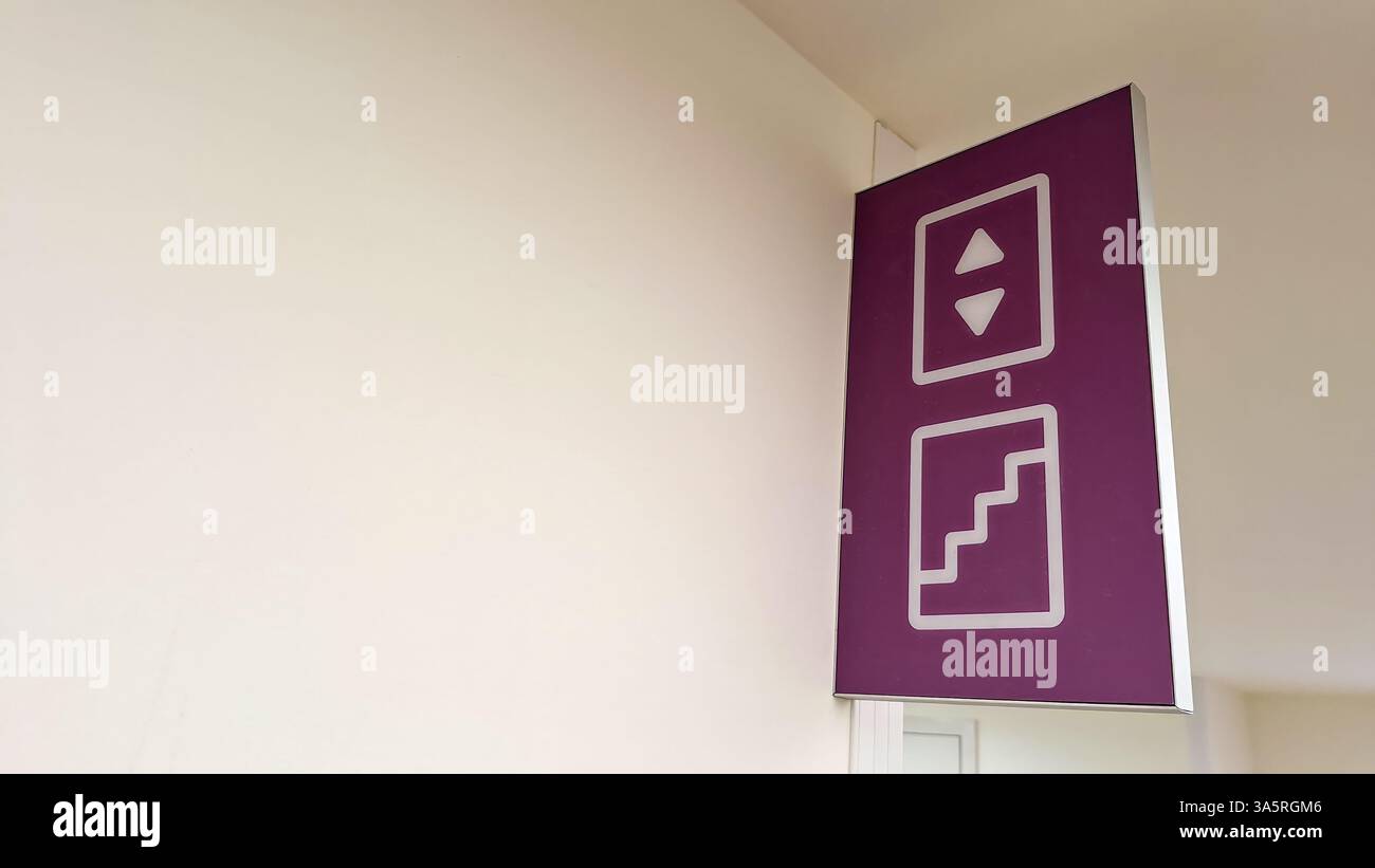 Purple elevator and staircase sign interior directional guidance Stock ...