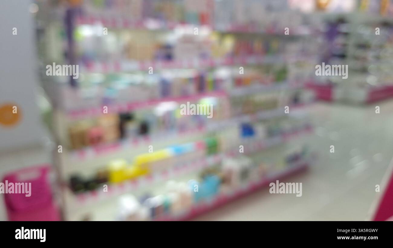 Blurred view of colorful pharmacy shelf display in modern store Stock ...