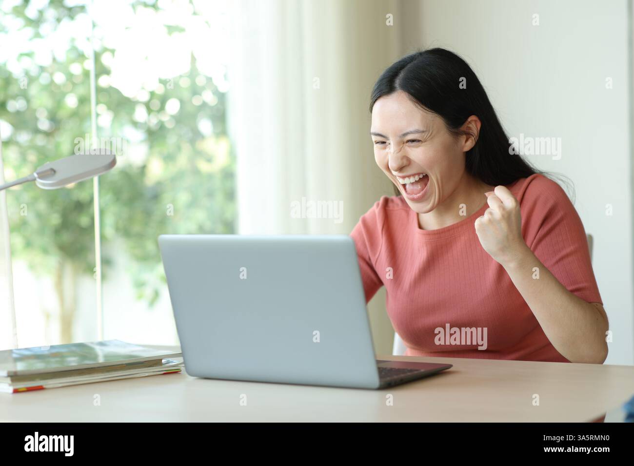 Excited woman computer home hi-res stock photography and images - Alamy