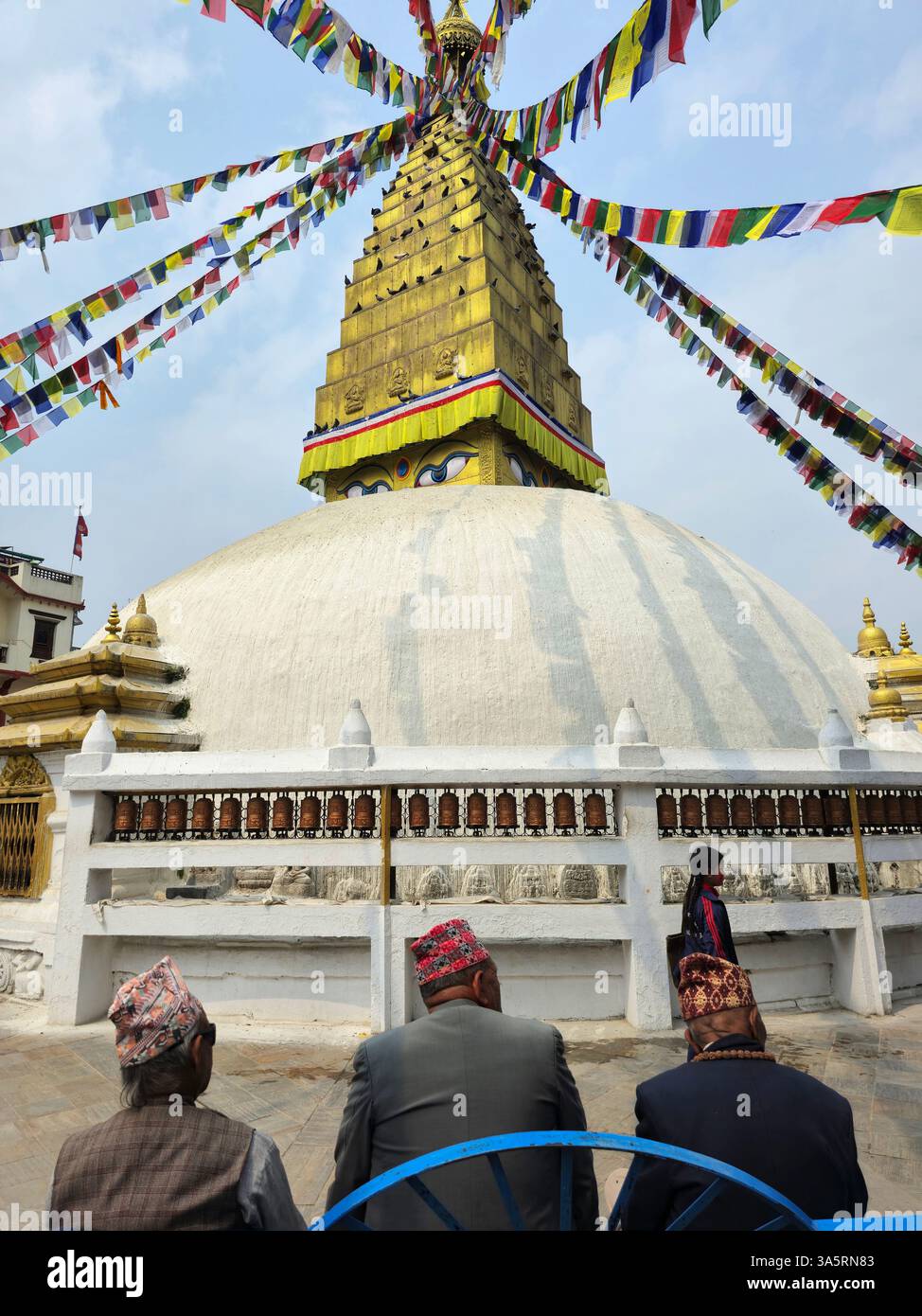 Nepali men sitting by the Charumati Stupa in Kathmandu, Nepal Stock ...
