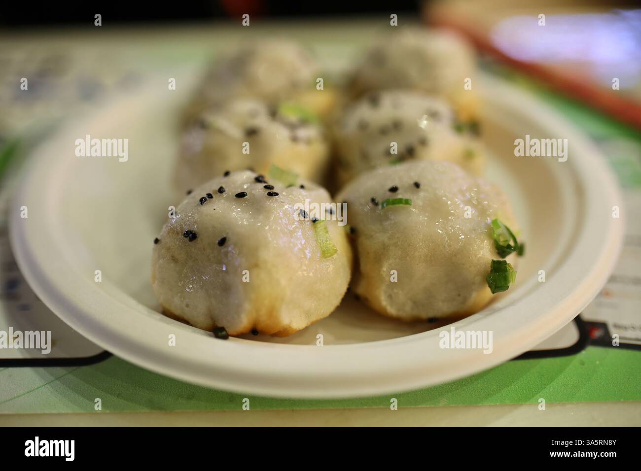 Fried dumplings are sold inside the New World Mall in Flushing. Queens ...