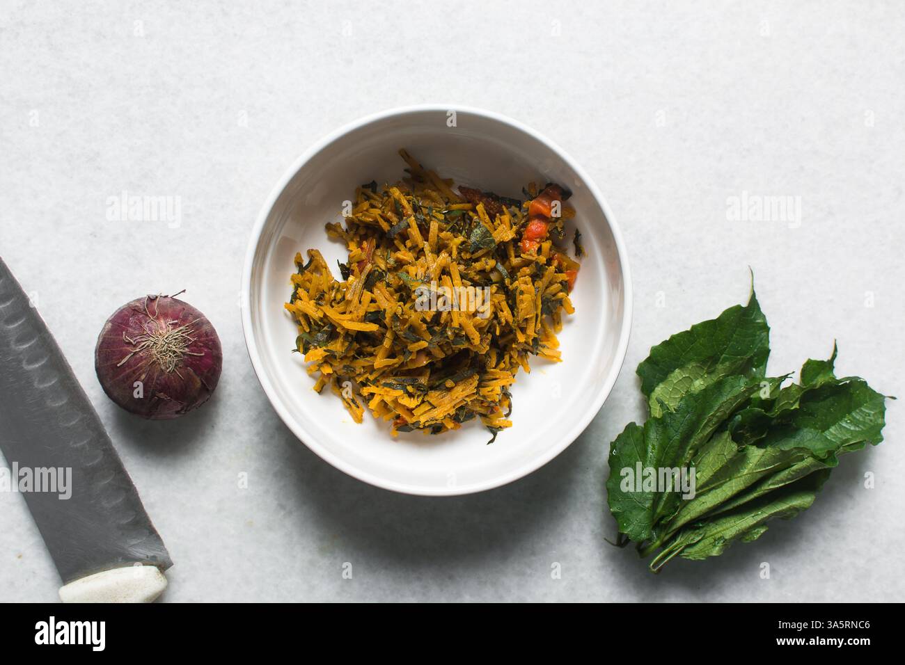 Overhead view of abacha or african salad in a white bowl, top view of ...