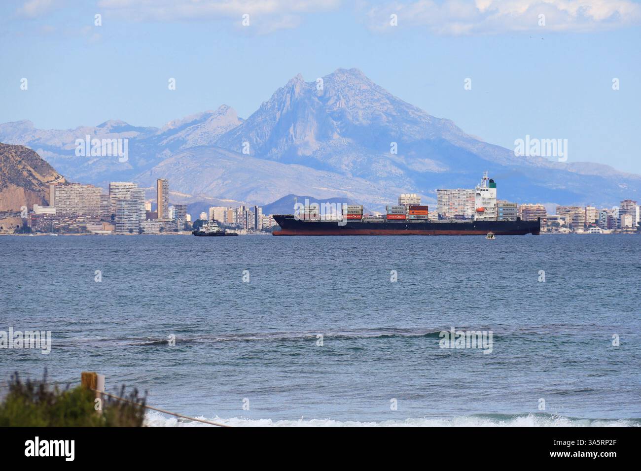 Alicante, Span- March 15, 2025:Cargo ship entering the port and ...
