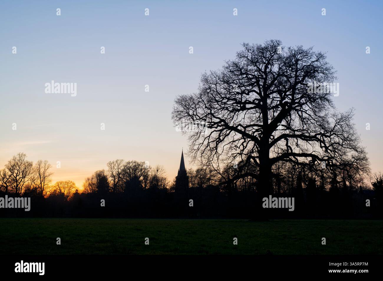 St Marys Church at dusk in Adderbury, Oxfordshire, England. Silhouette ...