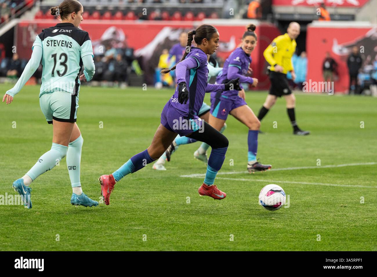 Harrison, USA. 23rd Mar, 2025. Ally Watt (11) of Orlando Pride controls ...