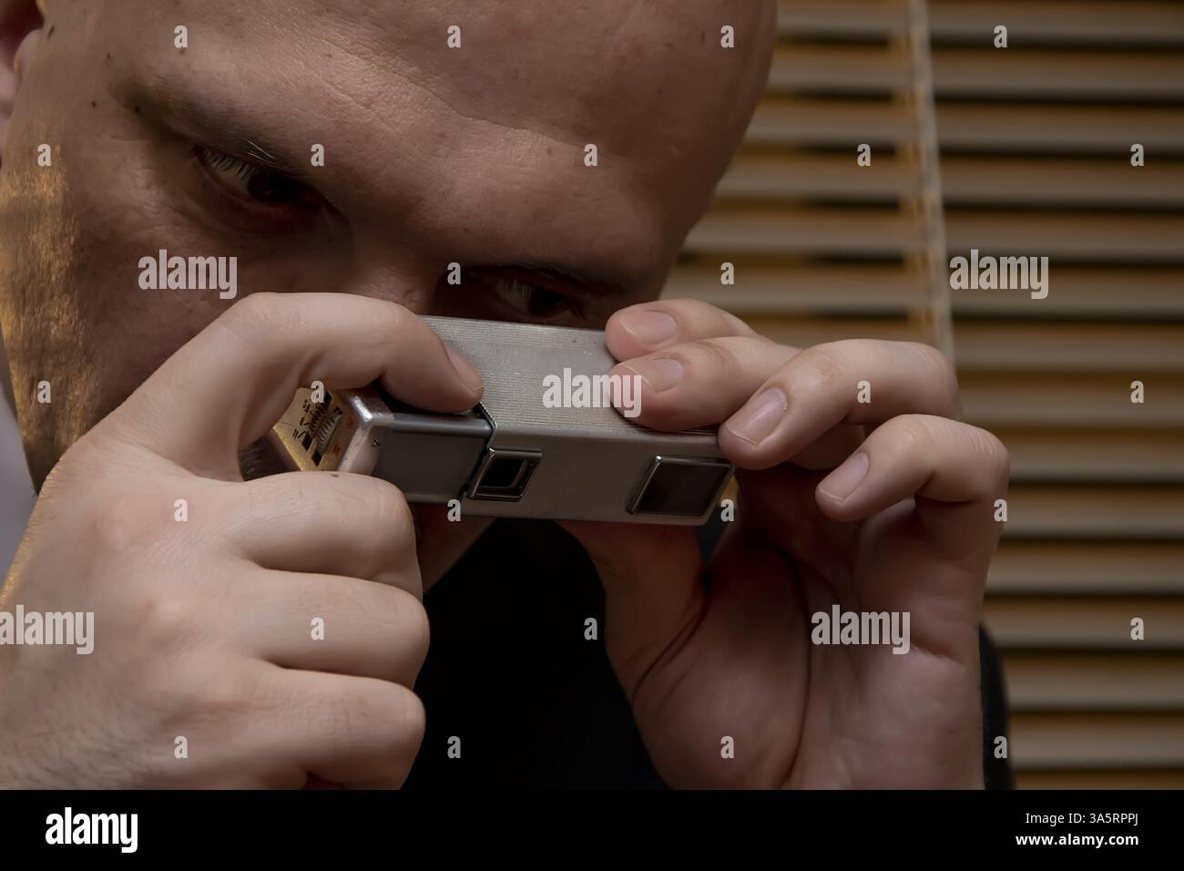 Spy photographs secret materials on a mini camera, collecting ...