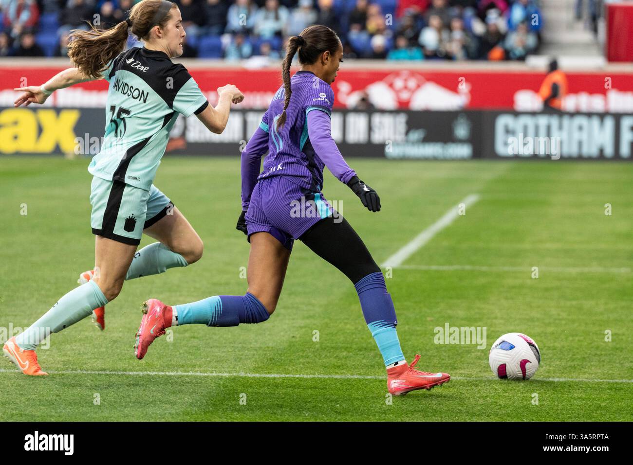 Harrison, USA. 23rd Mar, 2025. Ally Watt (11) of Orlando Pride controls ...